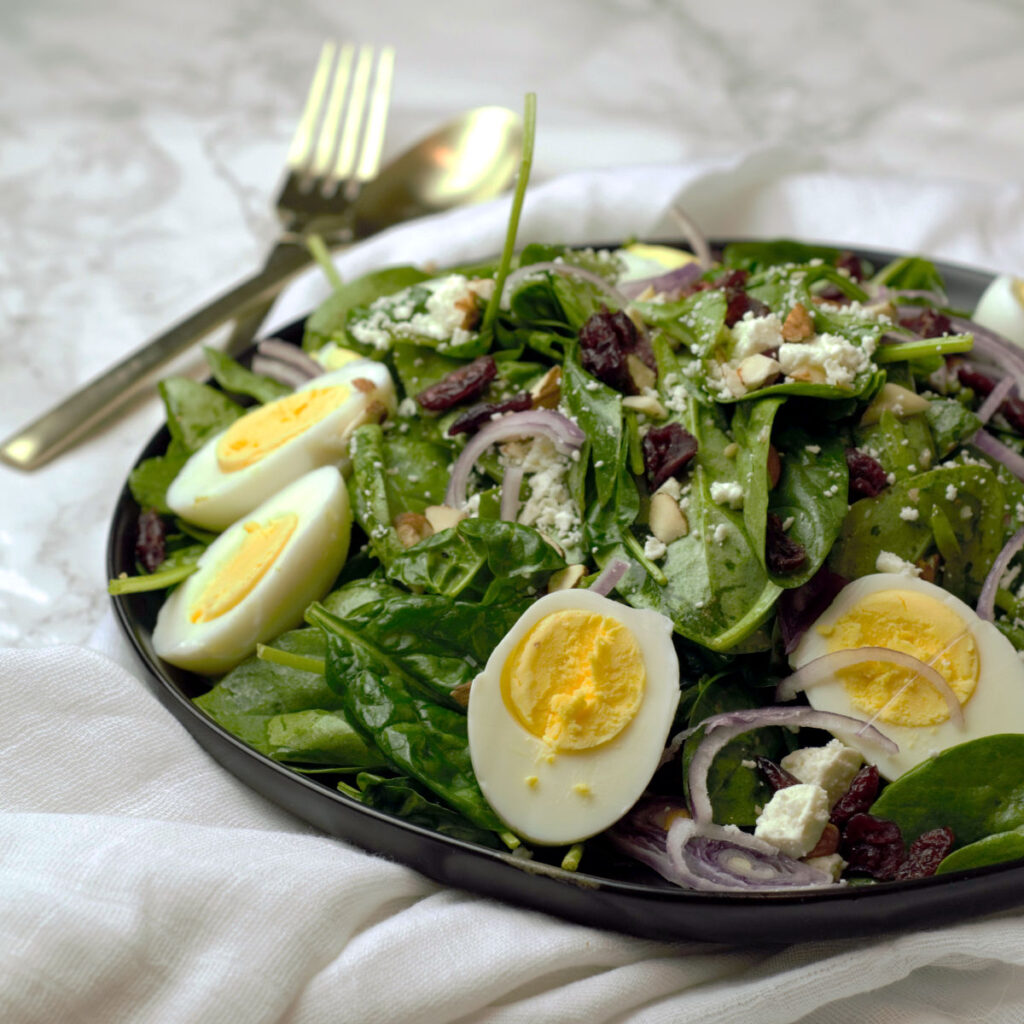 Wilted Spinach Salad with Warm Bacon Dressing - Delicious by Design